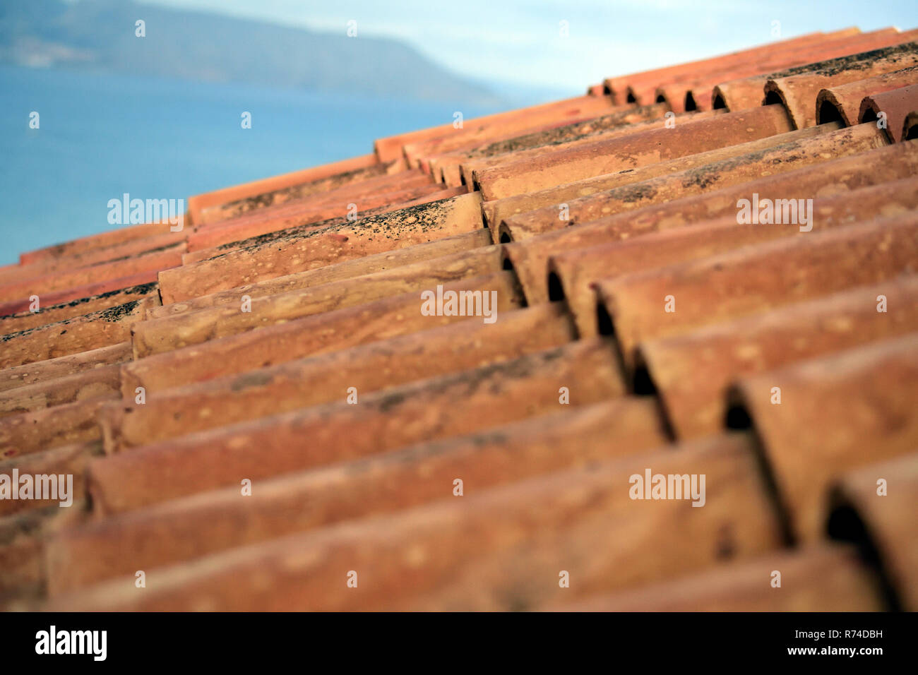 Side view of orange red roof tiles Stock Photo - Alamy