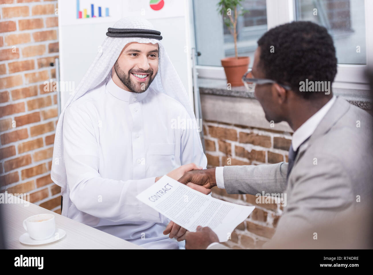Arab men holding hands hi-res stock photography and images - Alamy