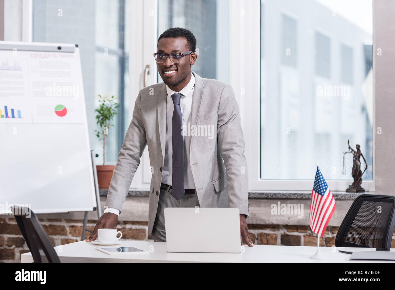 African american businessman smiling in modern office Stock Photo - Alamy