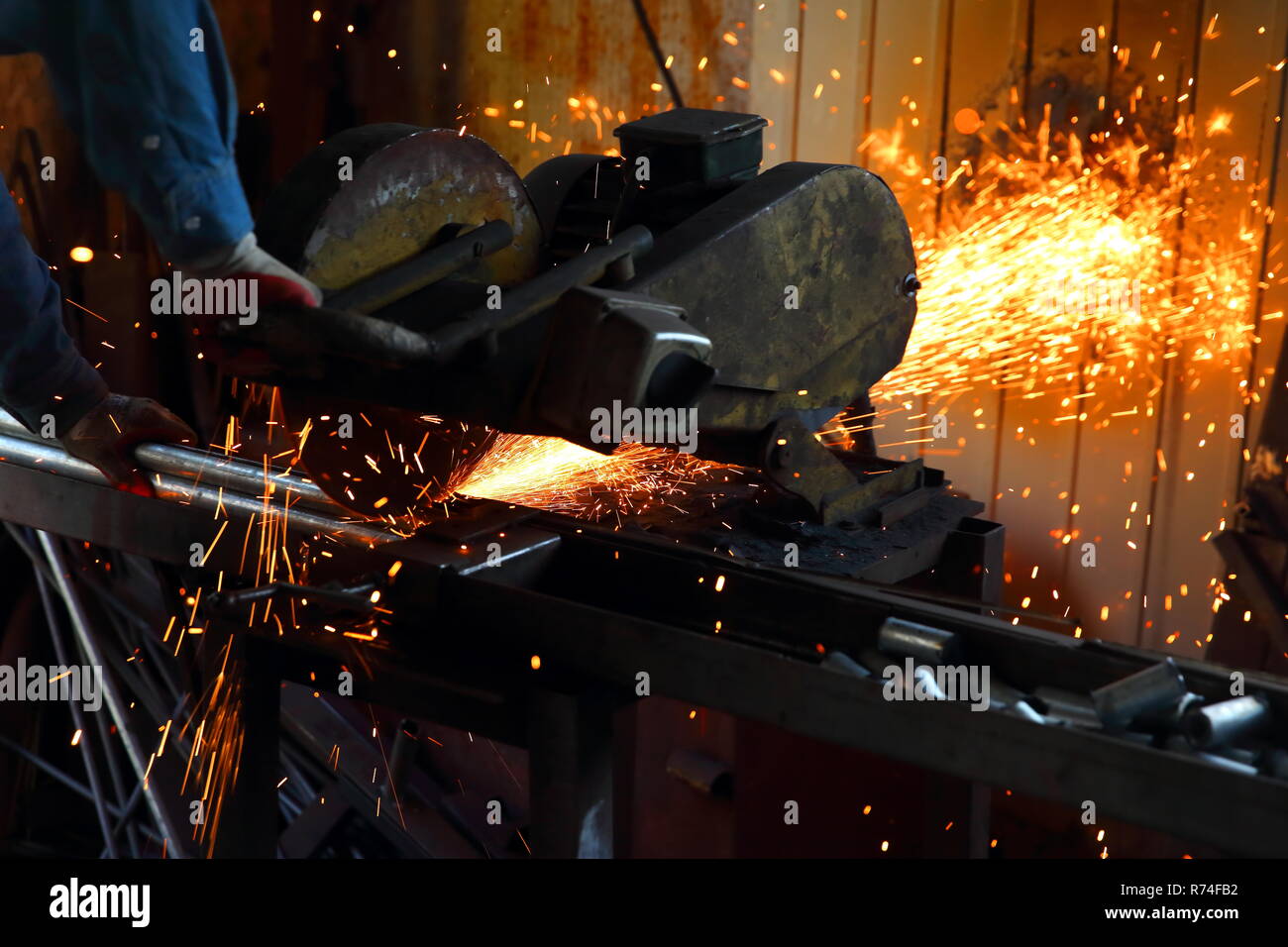 Cutting steel with a stationary large grinder Stock Photo - Alamy