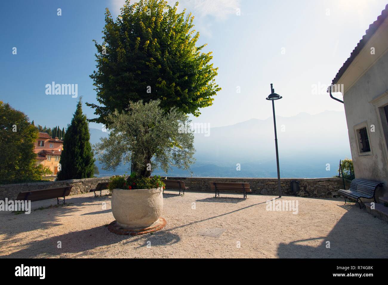 view of the famous terrace in a small town Tremosine at dawn. Italy ...