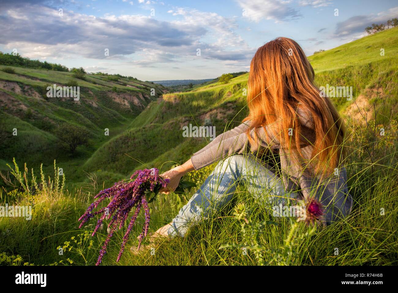 freedom - girl on the nature in sunset time Stock Photo - Alamy