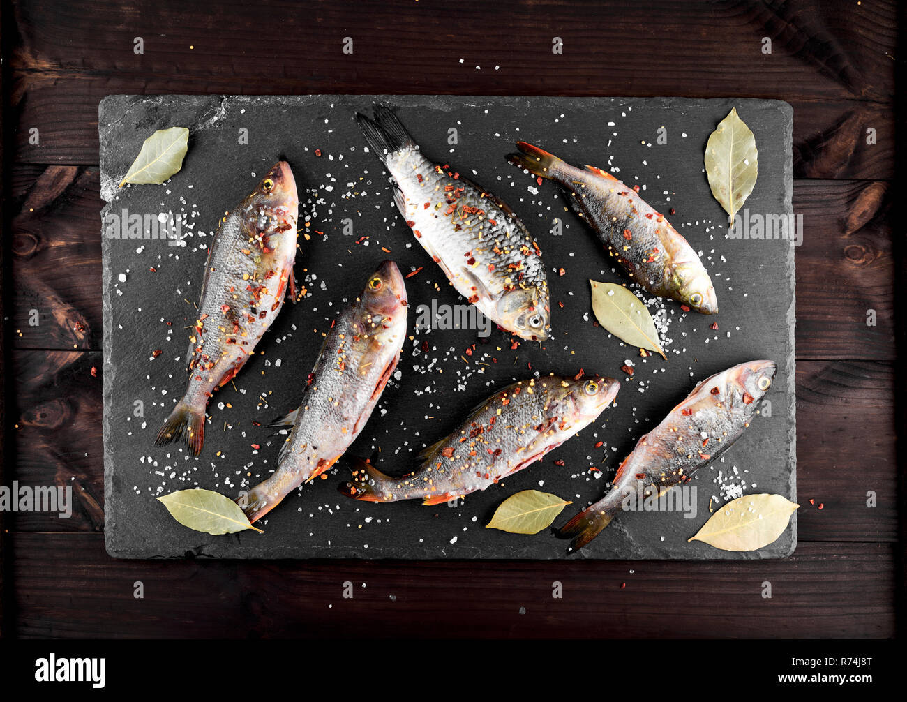 scraped river fish crucian and perch in spices and salt Stock Photo - Alamy