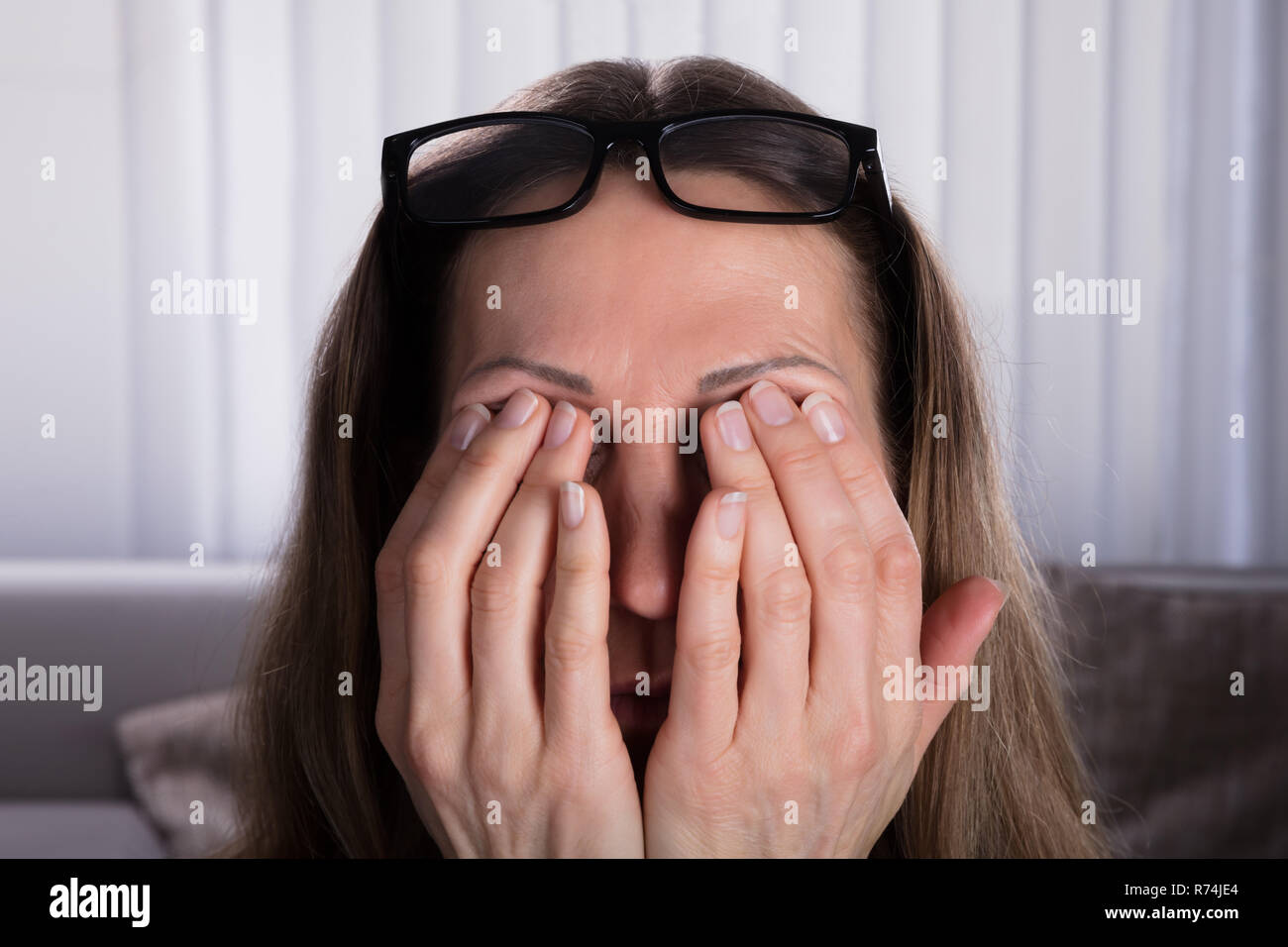 Woman eyes covering eyeglasses hi-res stock photography and images - Alamy