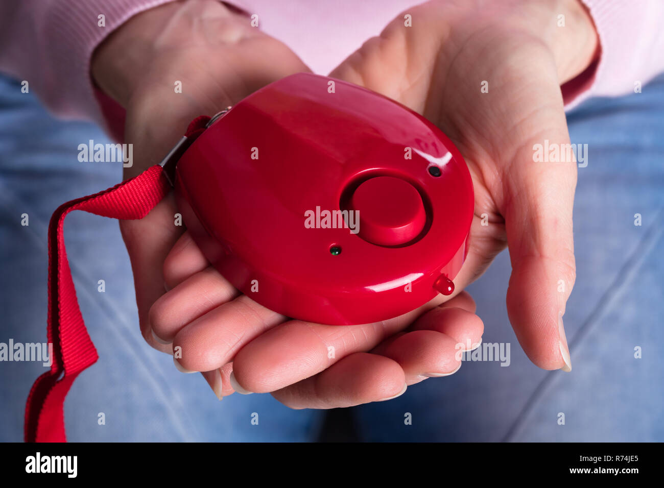 Woman Showing Personal Alarm Button Stock Photo - Alamy