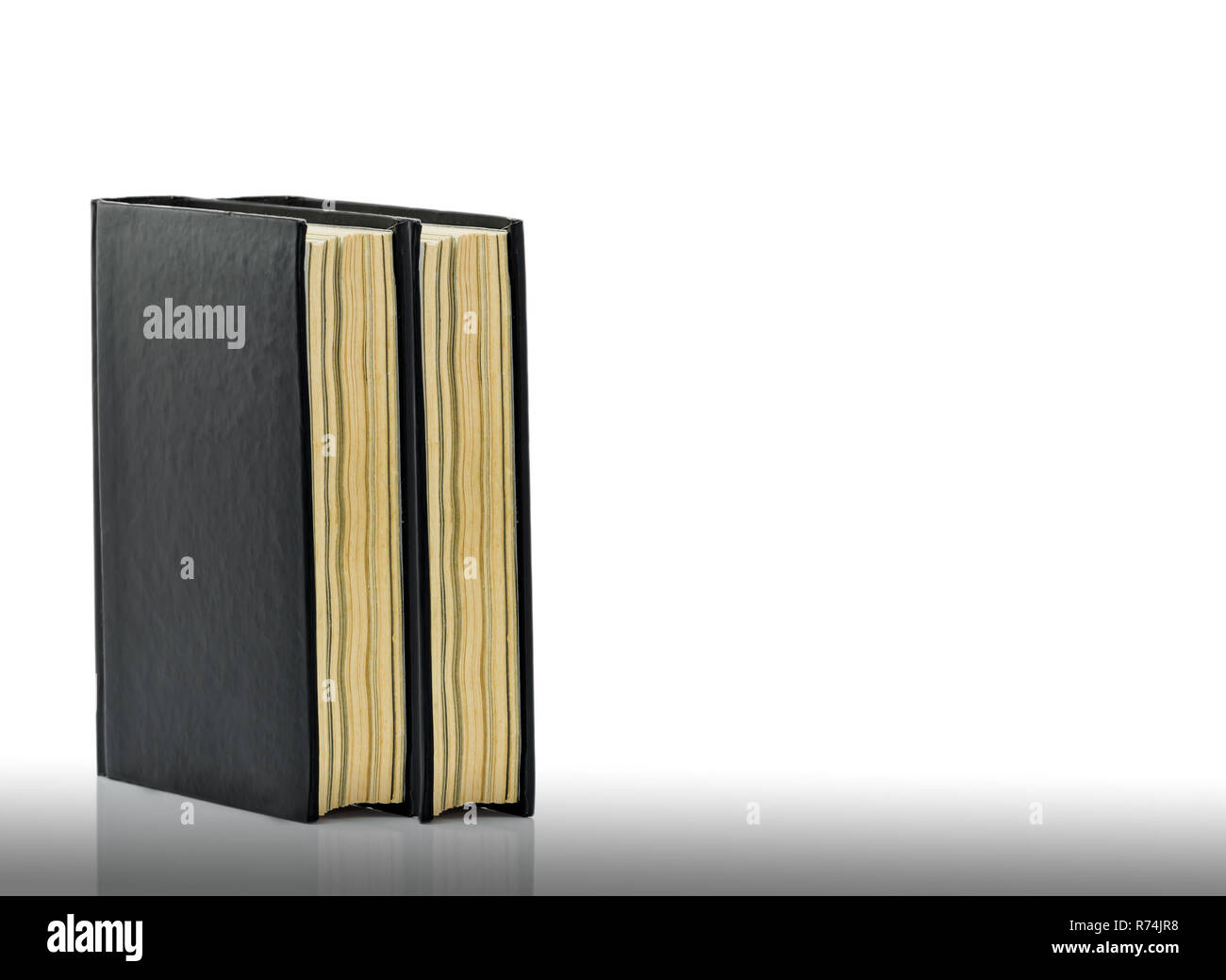 Closed black book is laying on white background Stock Photo - Alamy