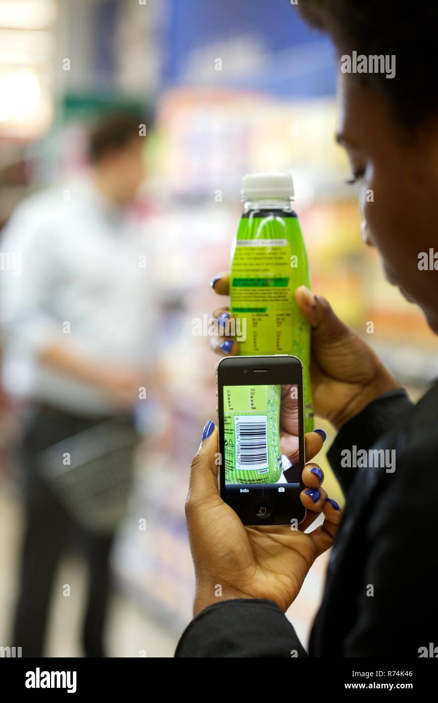 Shopping using a smart phone to scan barcodes of consumer goods in a ...