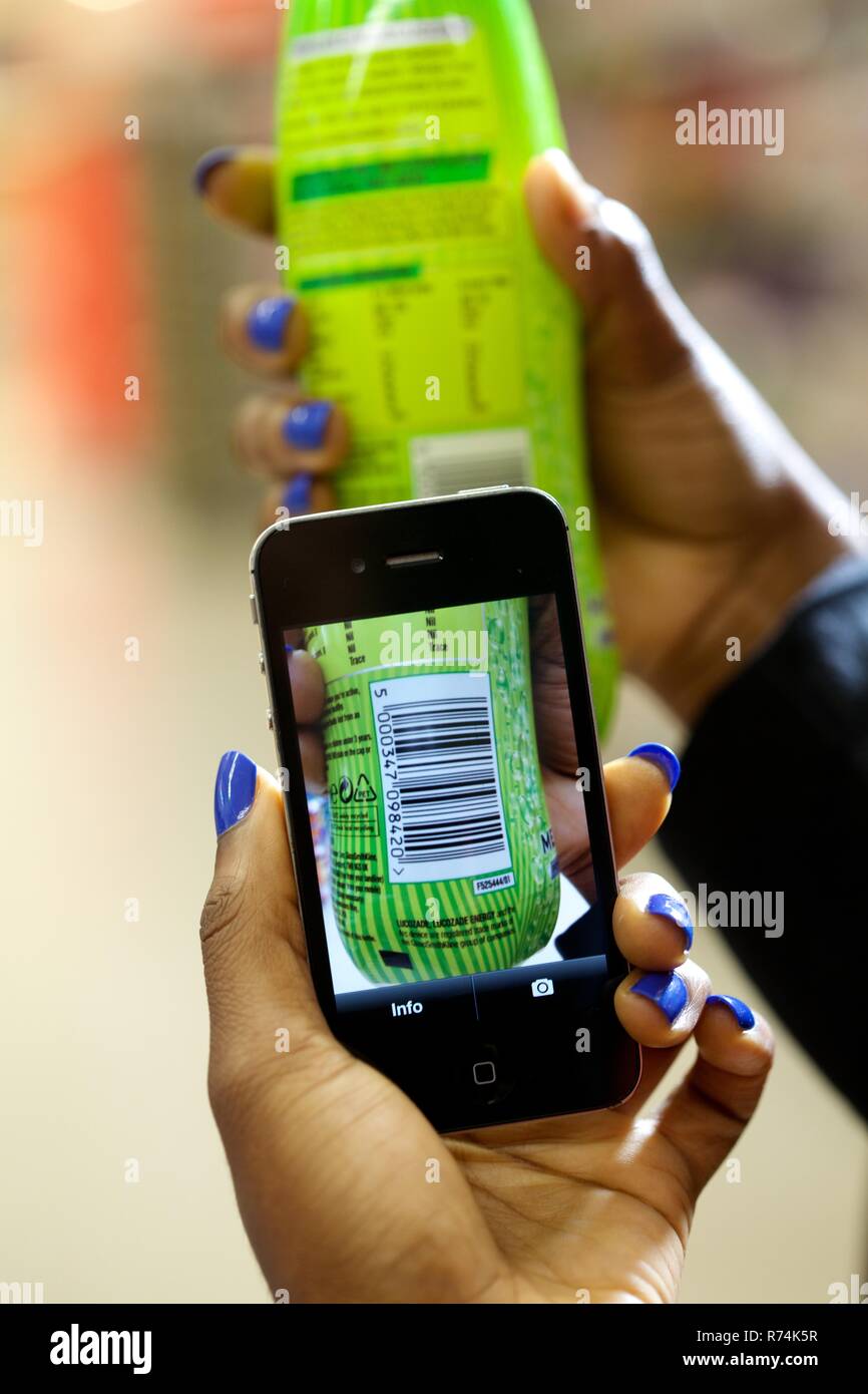 Shopping using a smart phone to scan barcodes of consumer goods in a ...