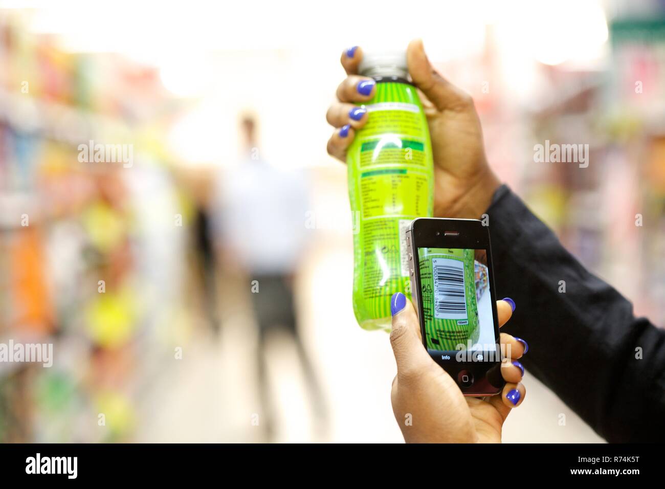 Shopping using a smart phone to scan barcodes of consumer goods in a ...