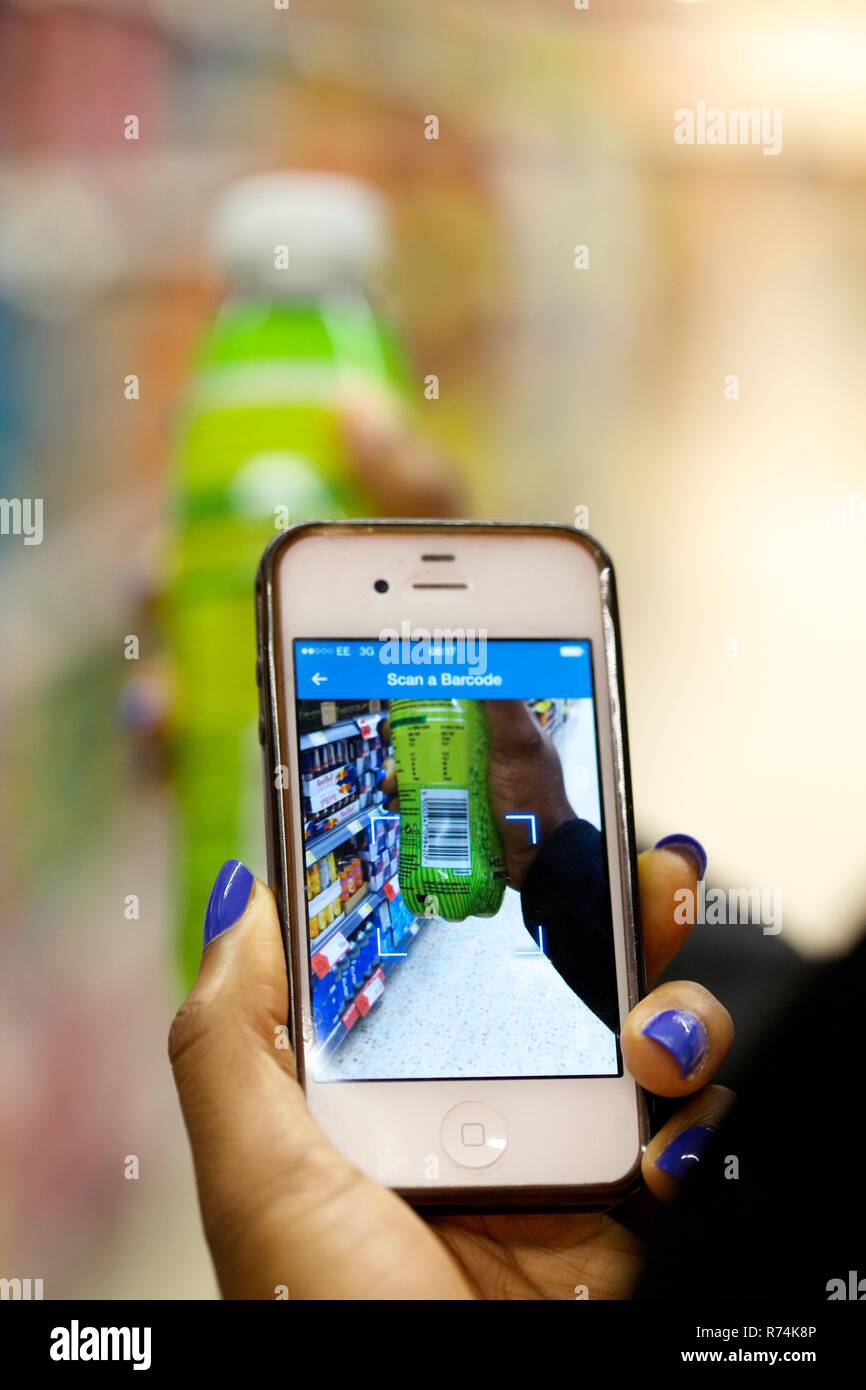 Shopping using a smart phone to scan barcodes of consumer goods in a ...