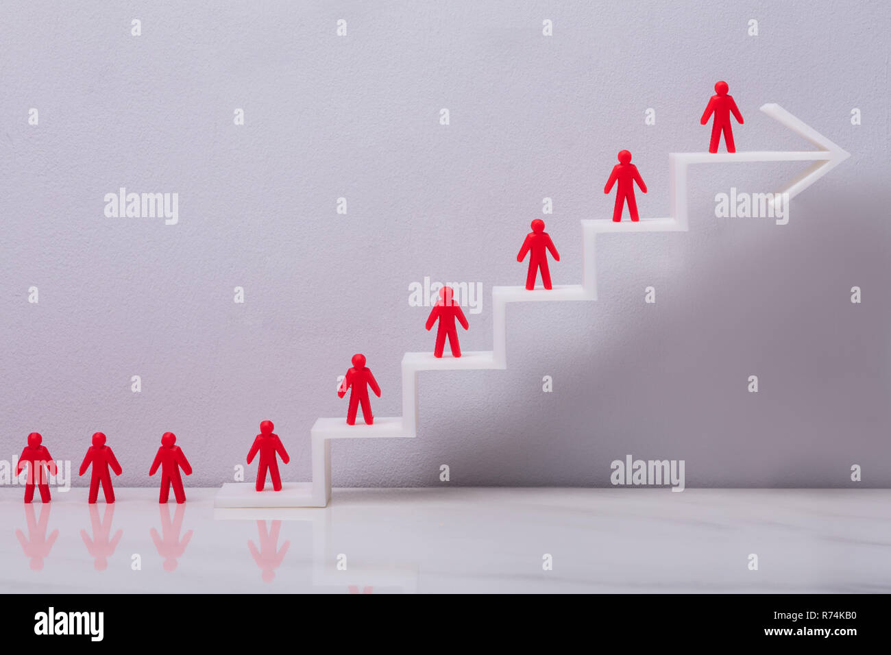 Red Human Figures On Increasing Graph Stock Photo - Alamy