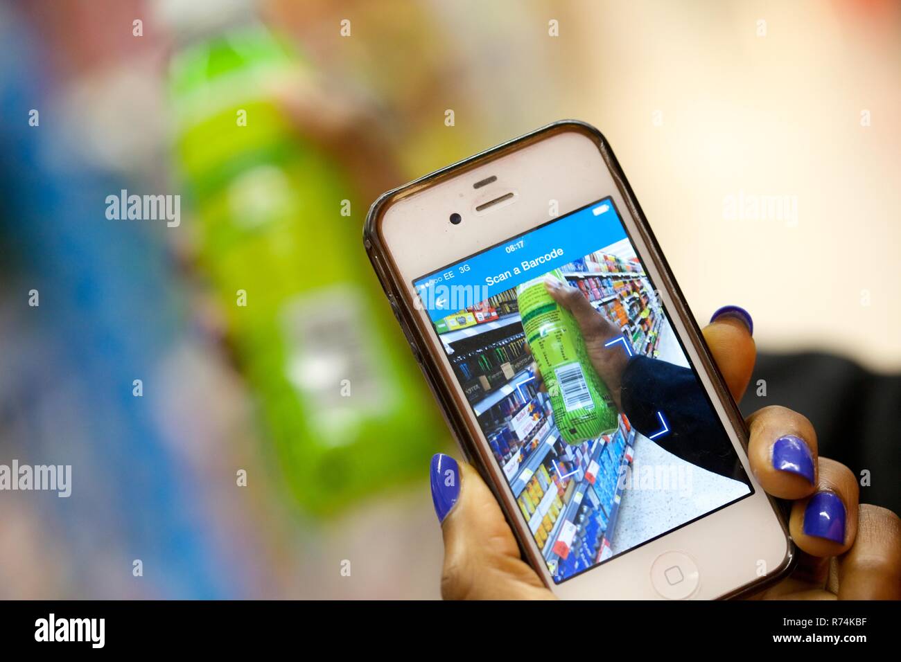 Shopping using a smart phone to scan barcodes of consumer goods in a ...