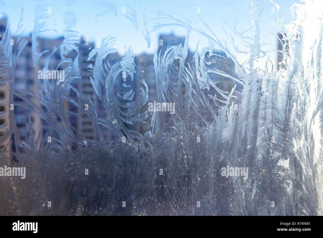 Frozen winter window with shiny ice frost pattern texture. Christmas ...