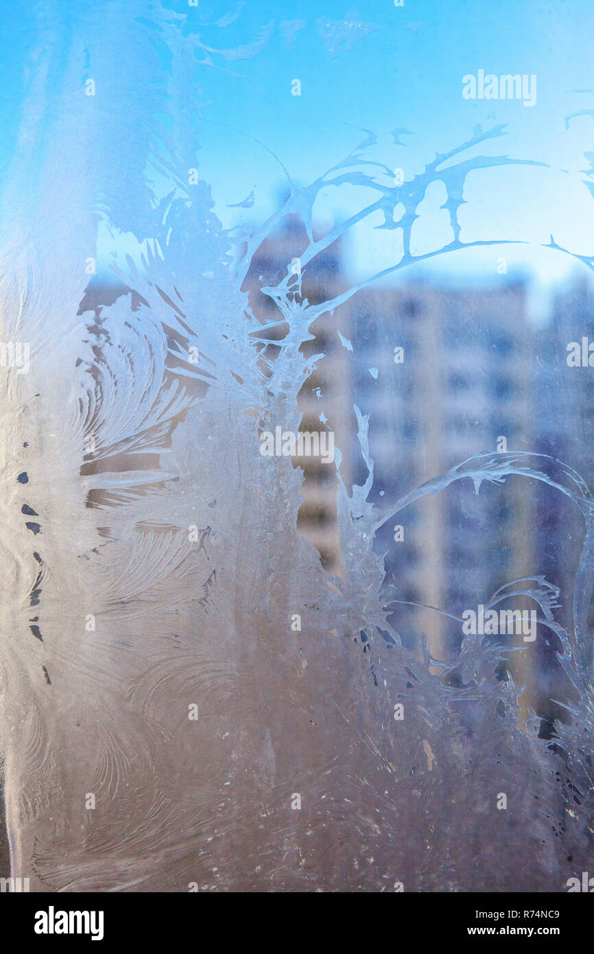 Frozen winter window with shiny ice frost pattern texture. Christmas ...