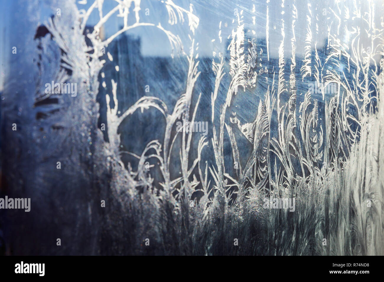Frozen winter window with shiny ice frost pattern texture. Christmas ...