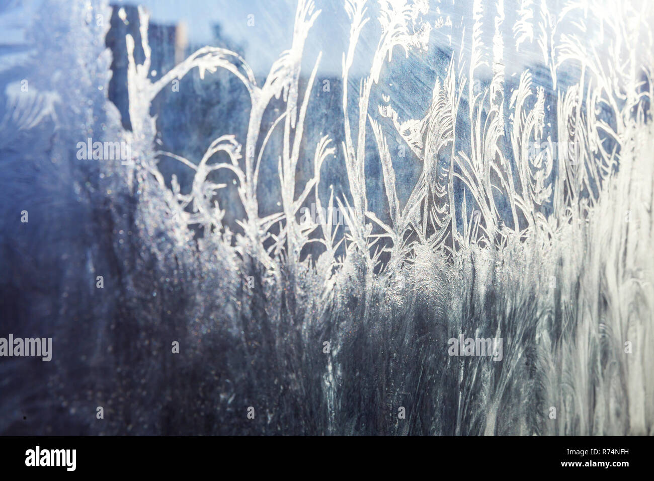 Frozen winter window with shiny ice frost pattern texture. Christmas ...