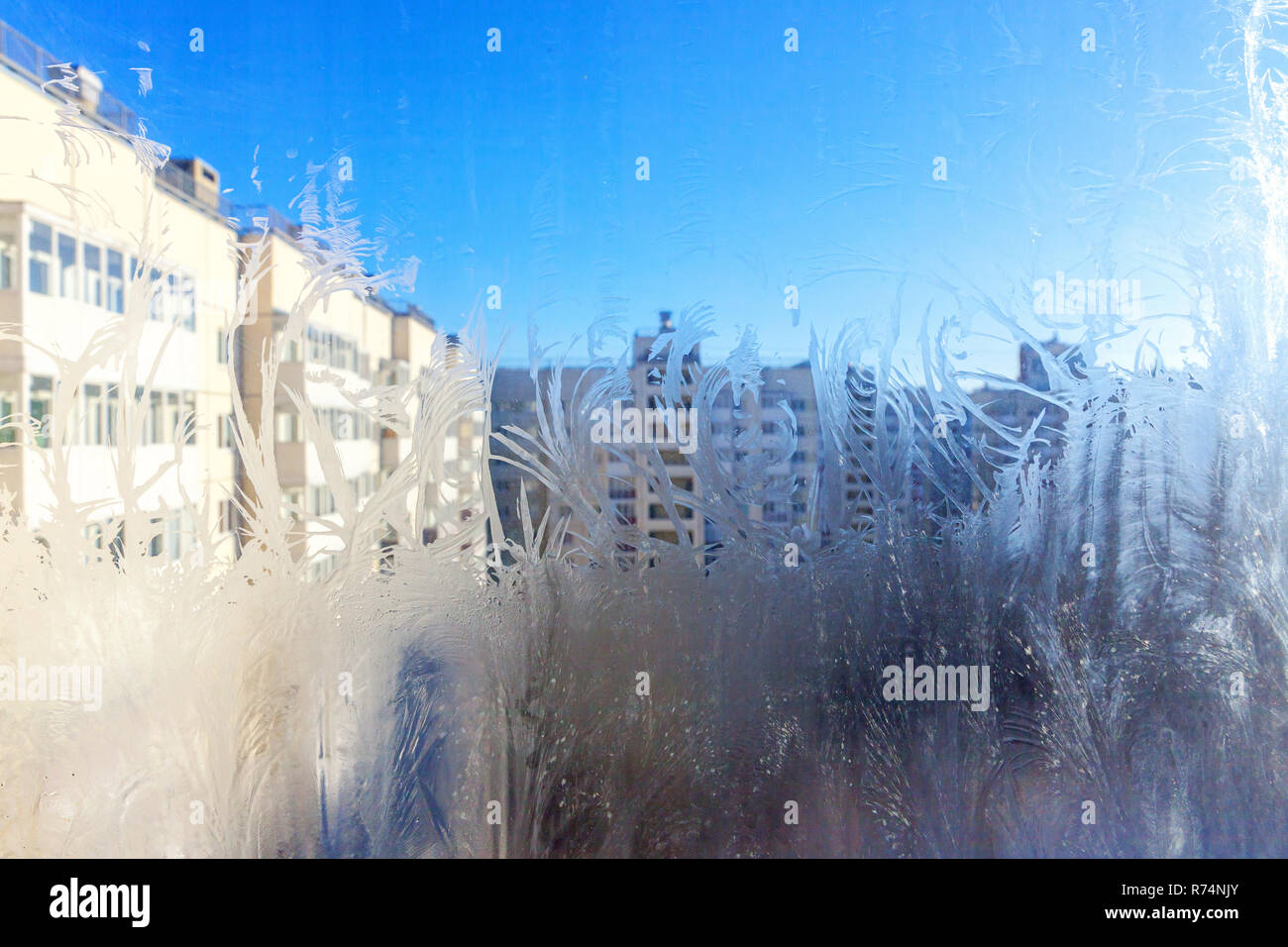Frozen winter window with shiny ice frost pattern texture. Christmas ...