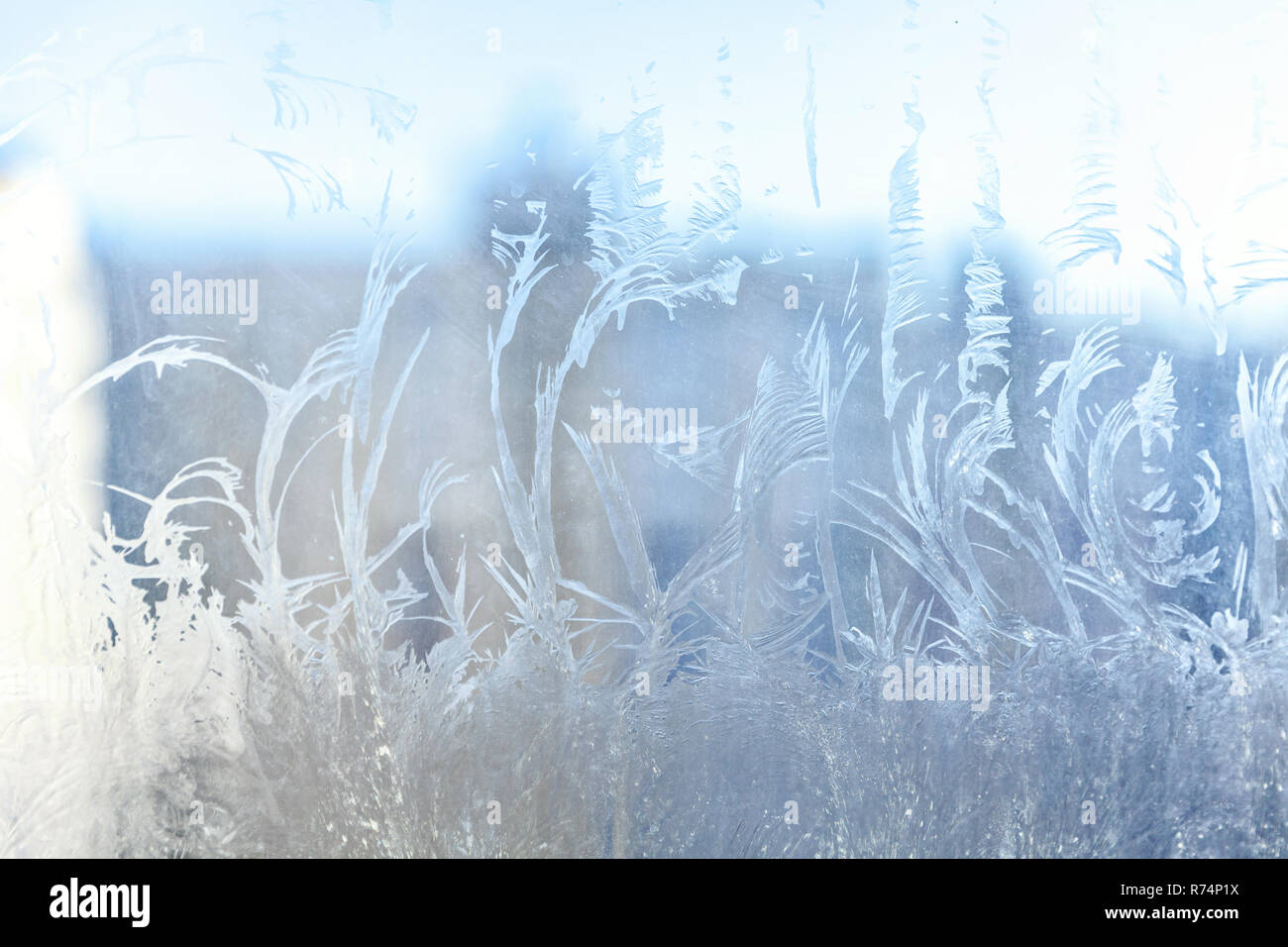 Frozen winter window with shiny ice frost pattern texture. Christmas ...
