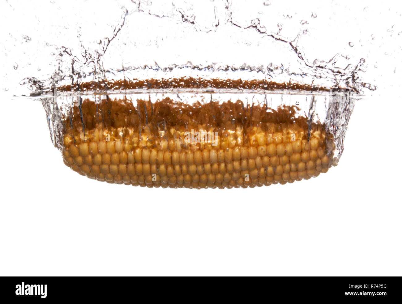 Corn on the cob sinking underwater Stock Photo - Alamy