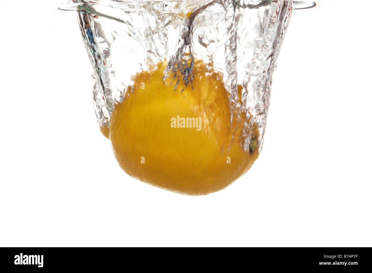 Lemon falling underwater. Clean and vibrant Stock Photo - Alamy
