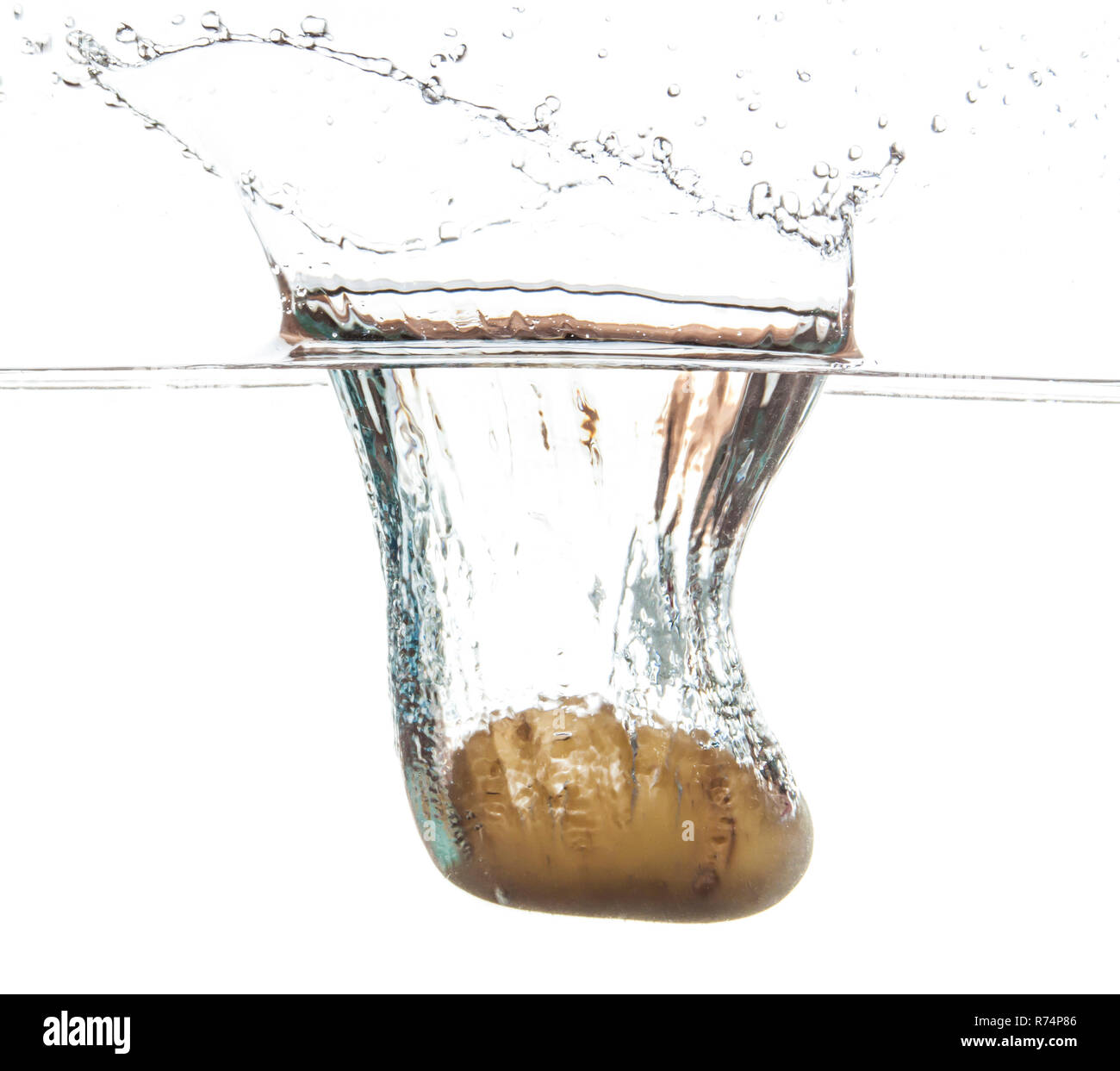 Potato splashing and sinking underwater. White beackgroung Stock Photo ...