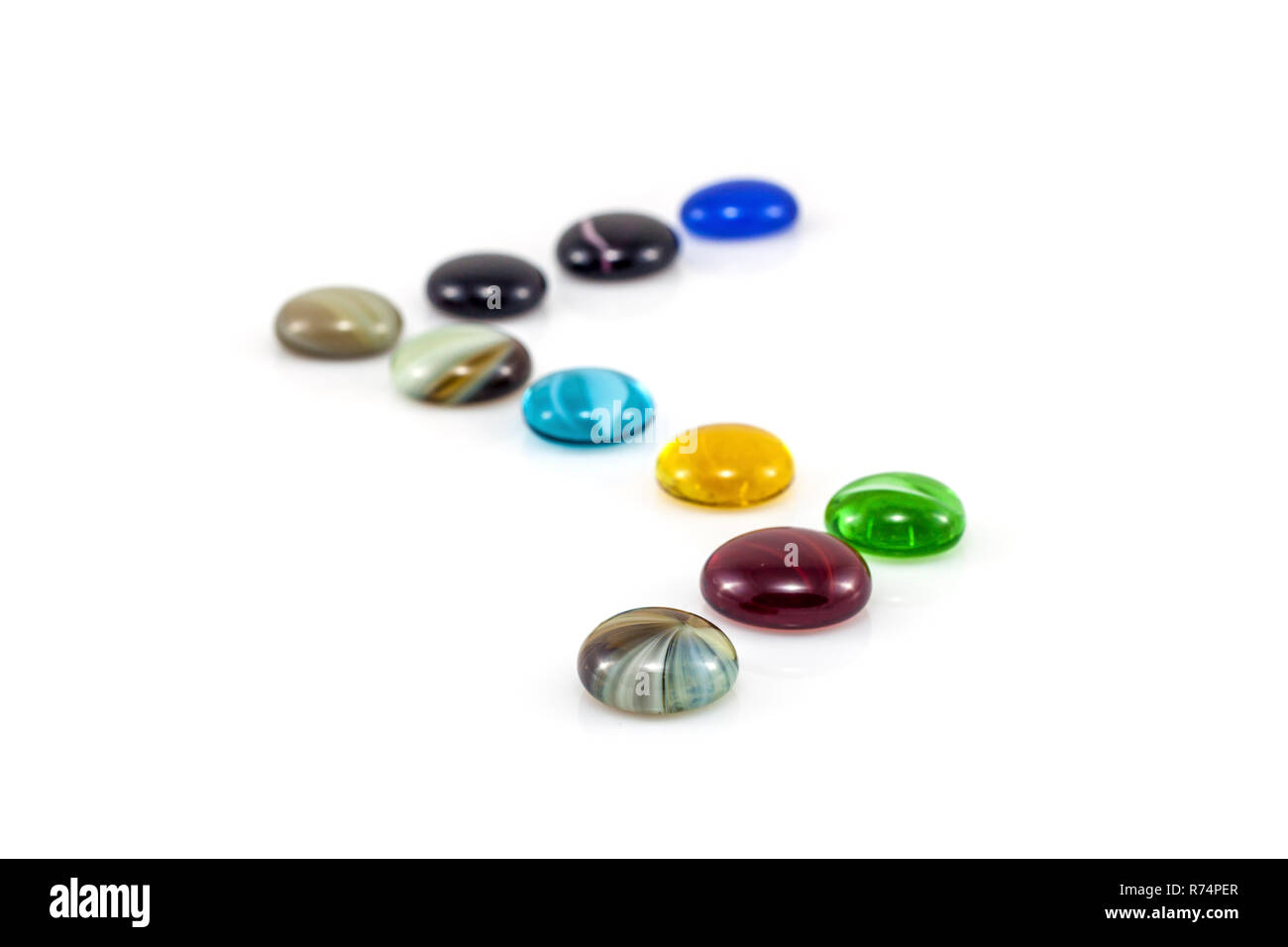 Decorative Gems arranged on a reflective surface Stock Photo - Alamy