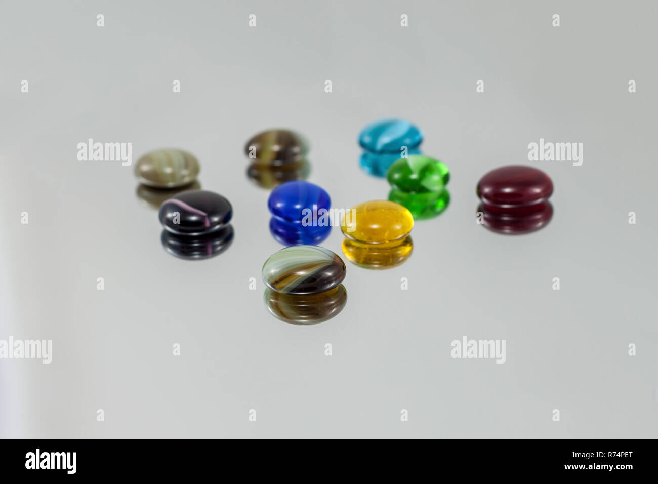 Decorative Gems arranged on a reflective surface Stock Photo - Alamy