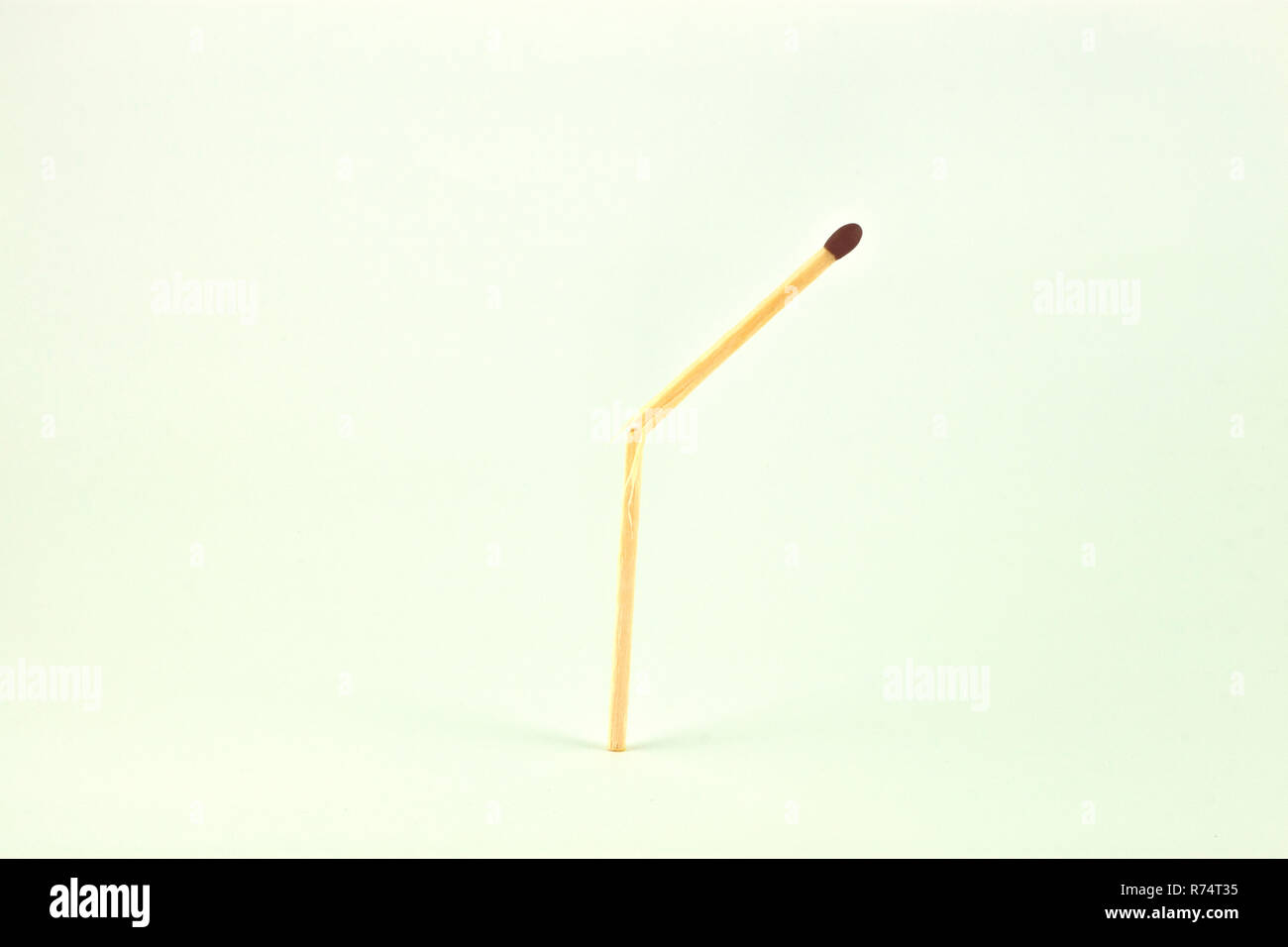 Broken matchstick standing straight Stock Photo - Alamy