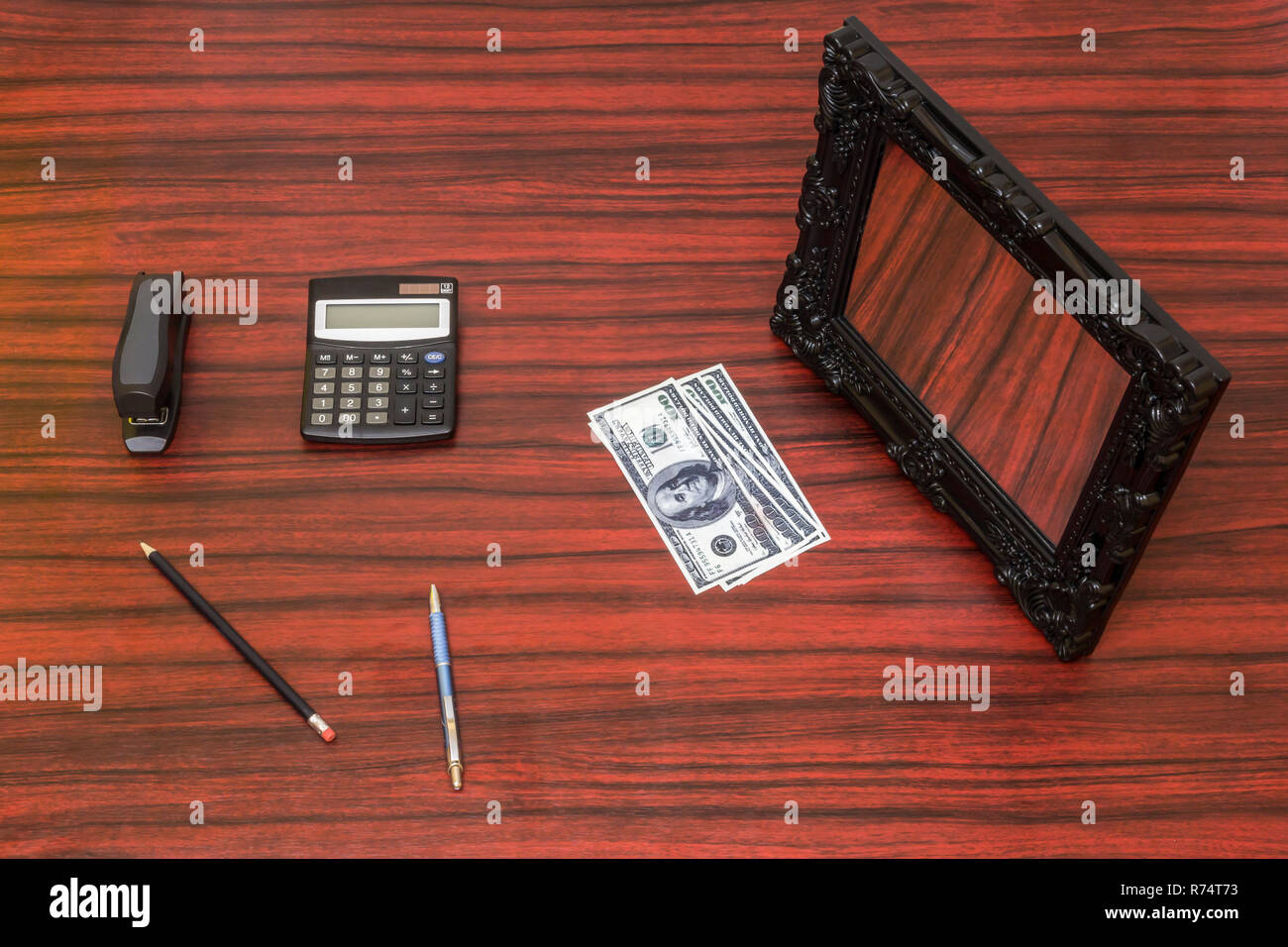 Money without reflection in the mirror. Both objects are surrounded by ...