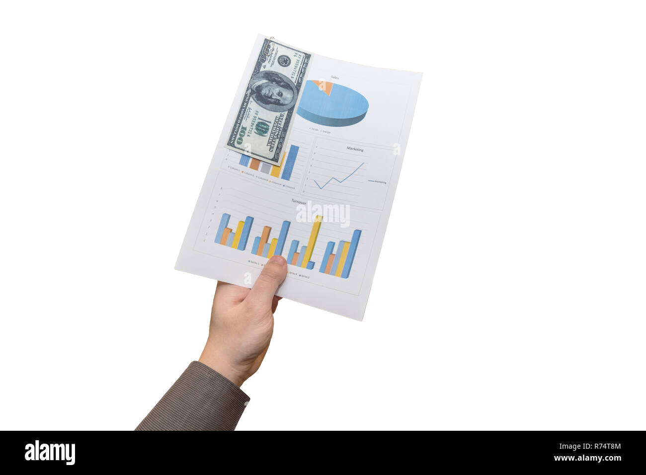 Human hand holding a sheet of paper with graphs on it and a 100 dollar ...