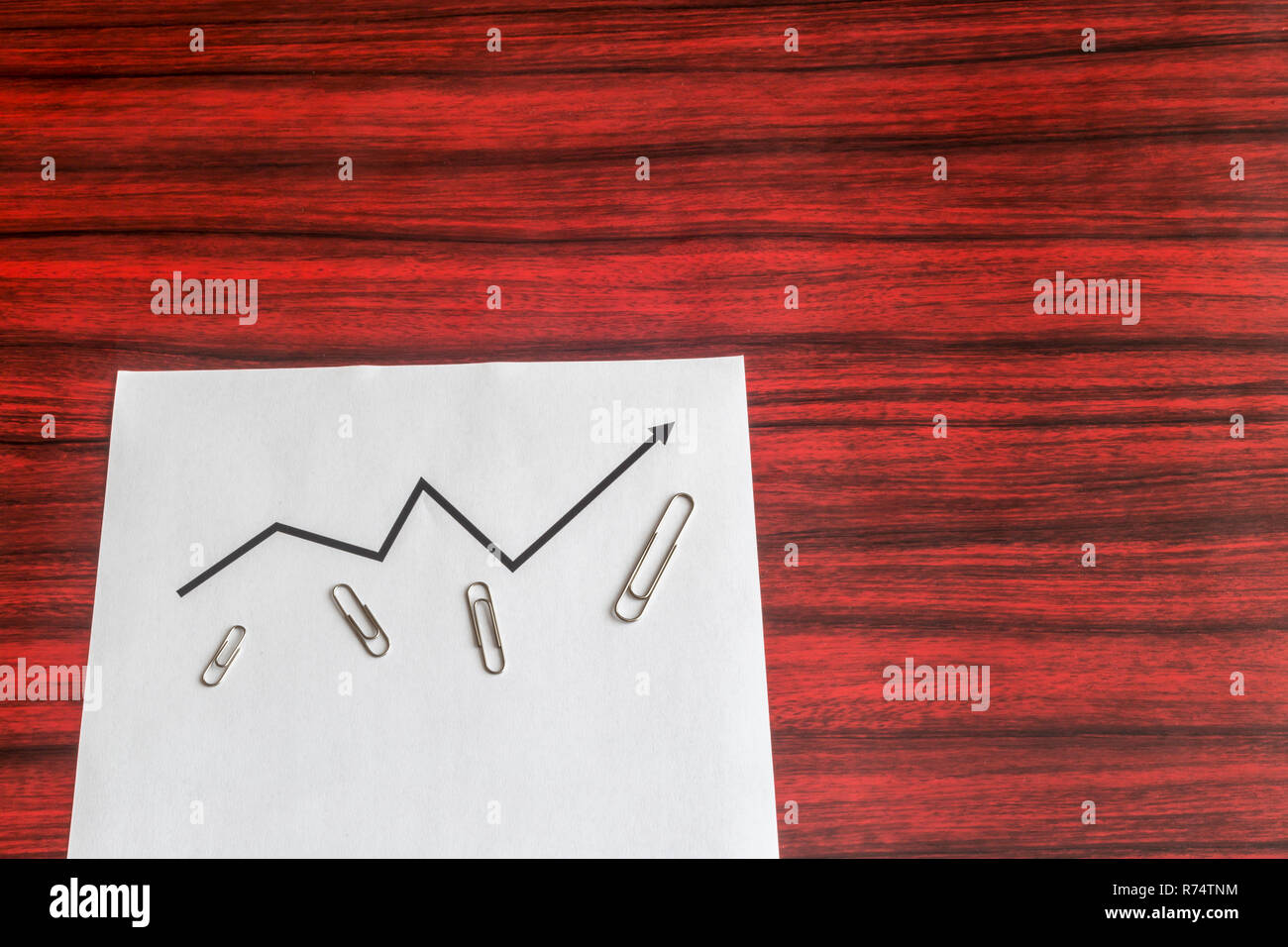 Sheet of paper with printed curve graph Stock Photo - Alamy