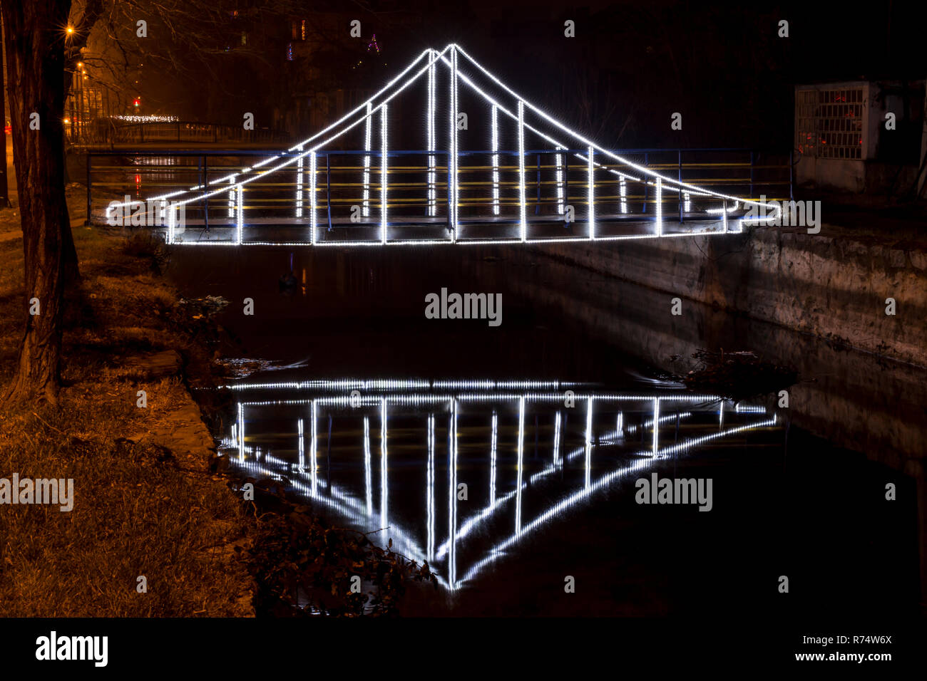 Pedestrian bridge decorated with Christmas lights Stock Photo - Alamy