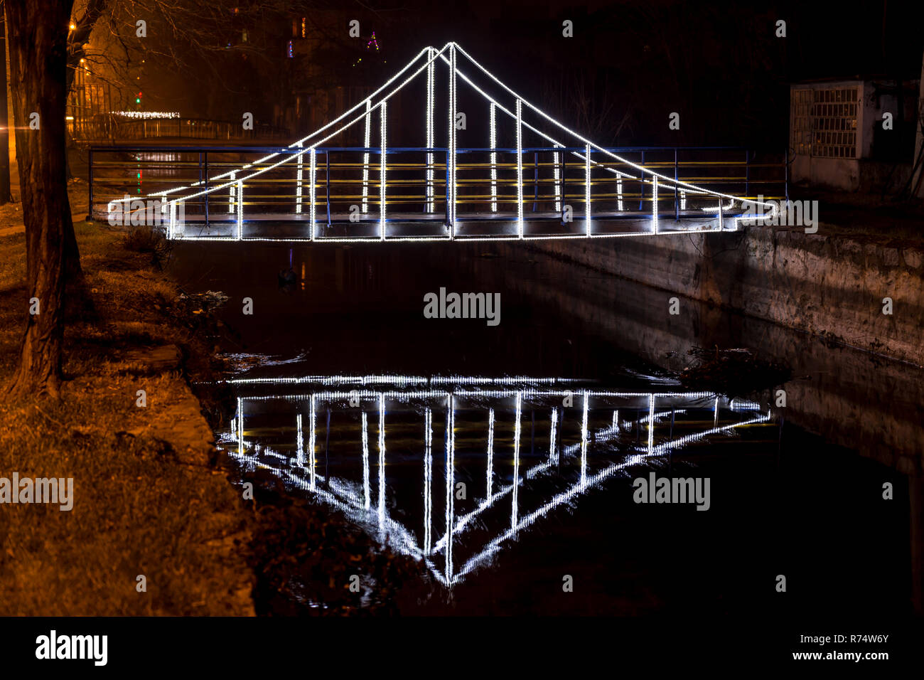 Pedestrian bridge decorated with Christmas lights Stock Photo - Alamy