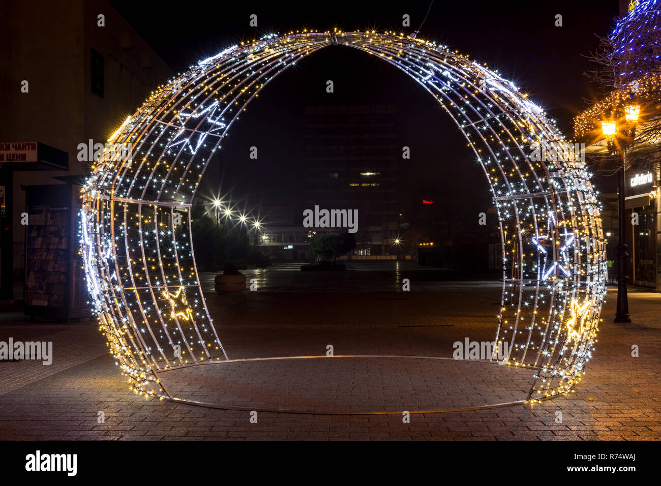 Christmas lights shaped as beautiful arch Stock Photo - Alamy