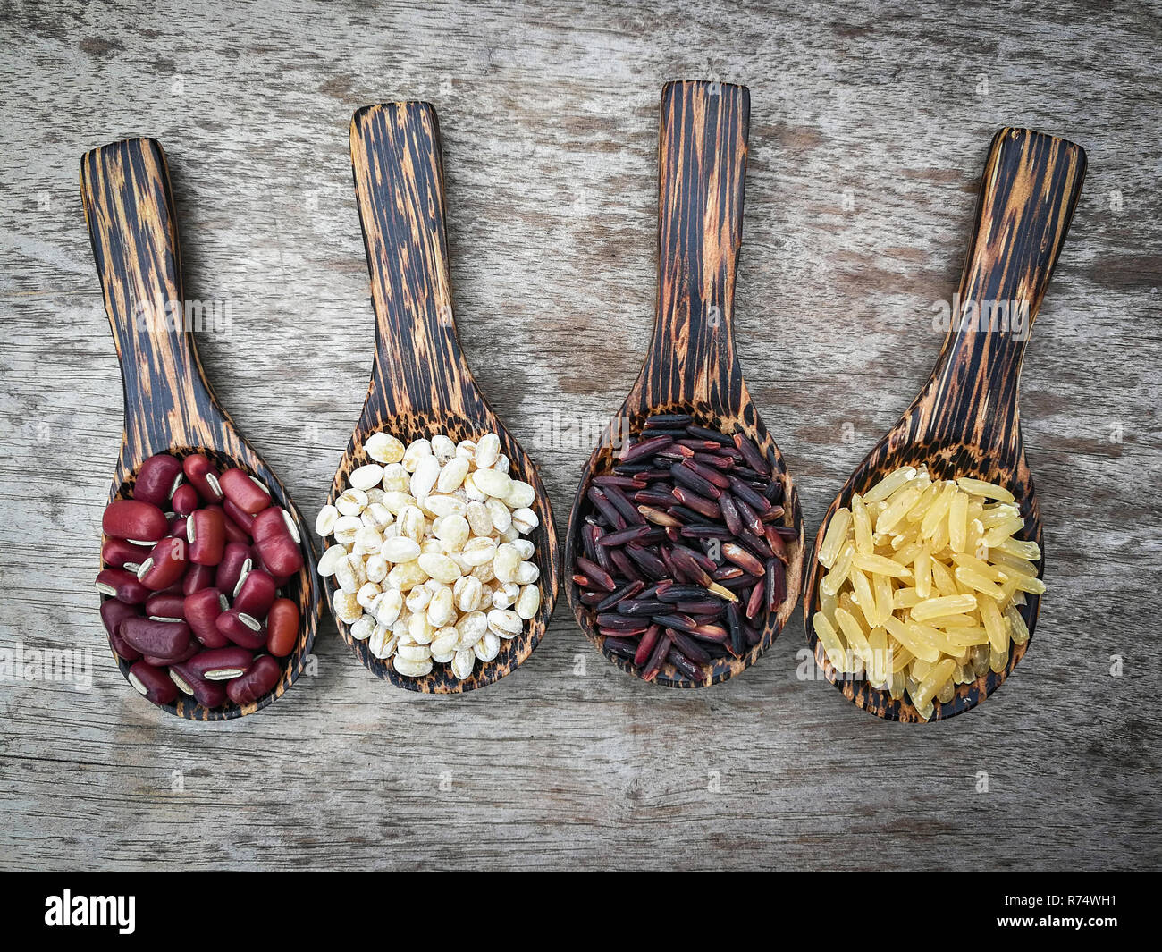 seed on wood spoon / grains or cereals seeds on wooden spoon various ...