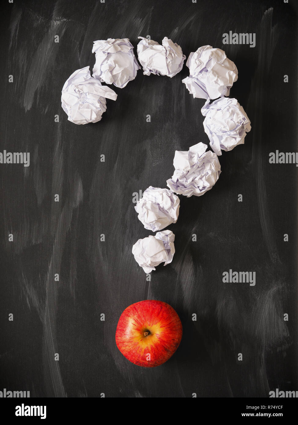 question mark with a red apple Stock Photo - Alamy