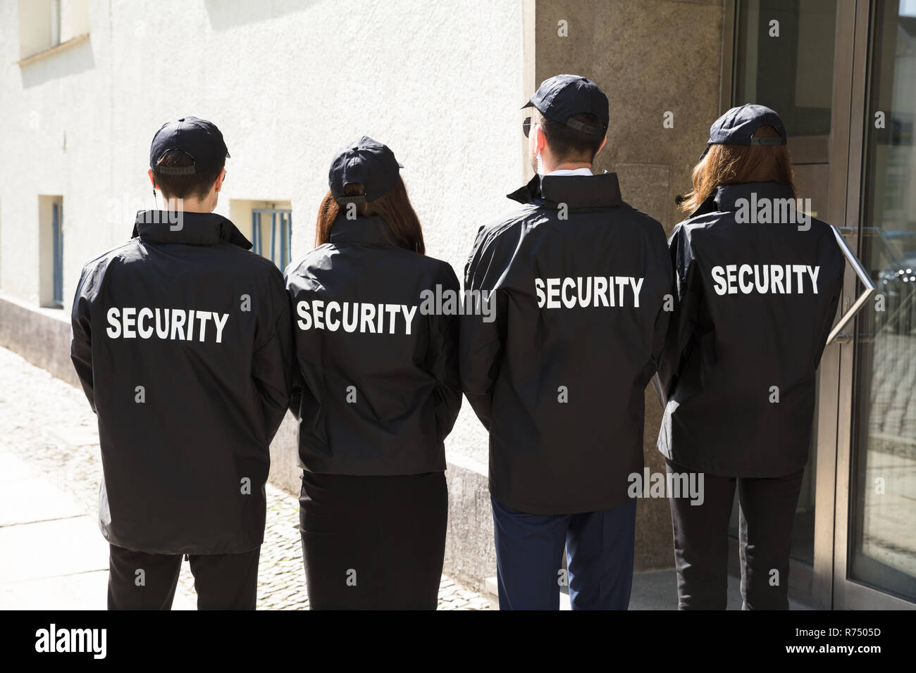 Rear View Of Security Guards Wearing Uniform Stock Photo - Alamy