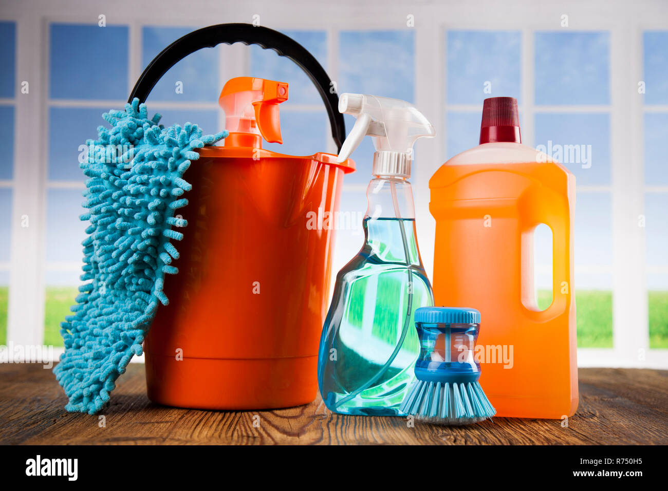 House cleaning product on wood table and window background Stock Photo ...