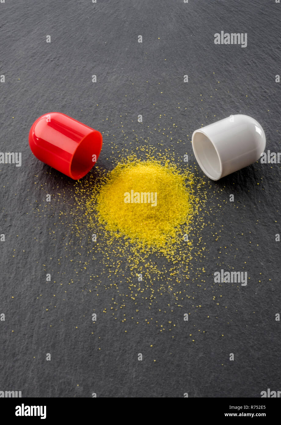 Open capsule powder medication, conceptual image Stock Photo - Alamy