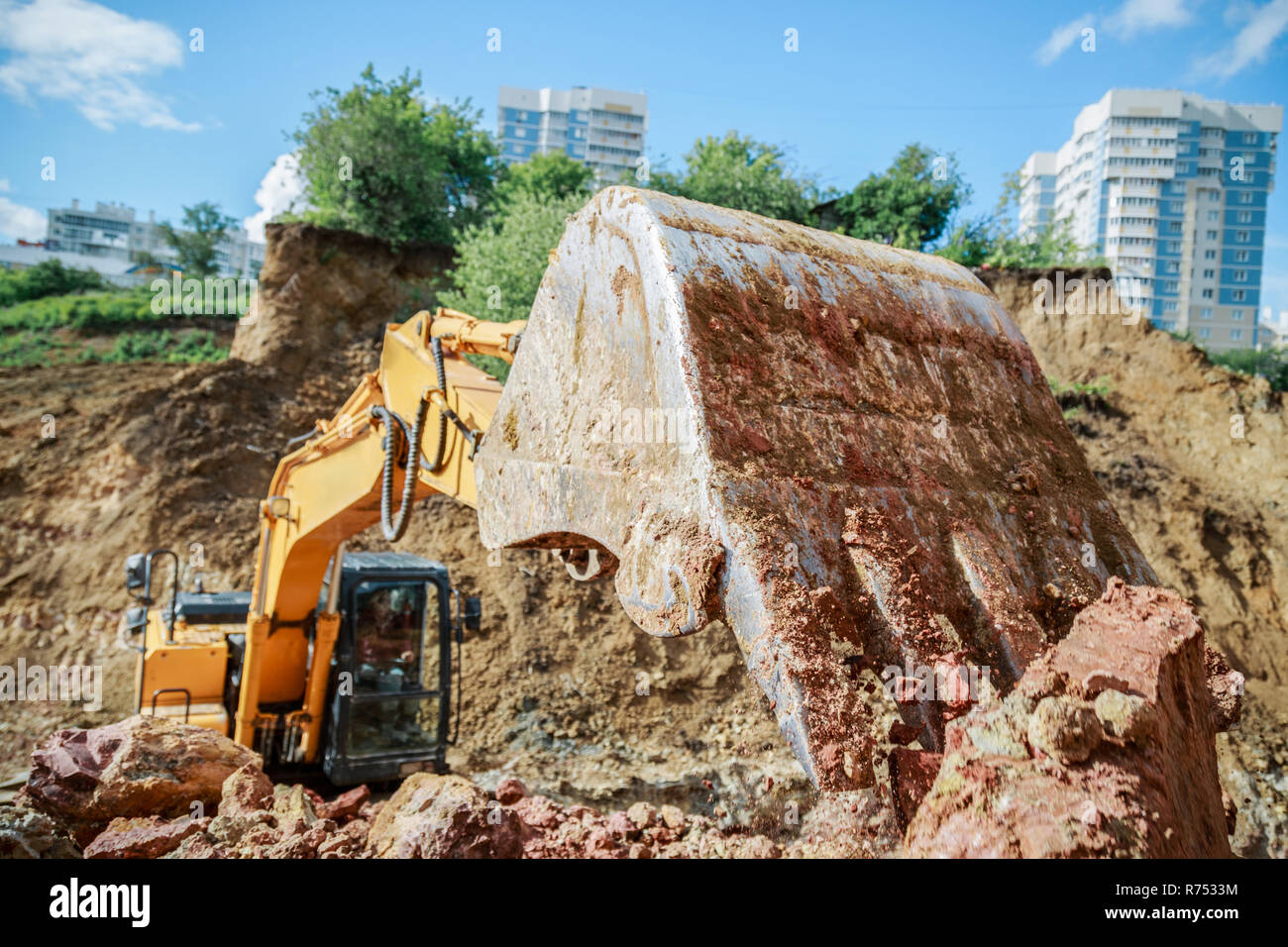 Excavator work at a construction site. Bucket closeup Stock Photo - Alamy