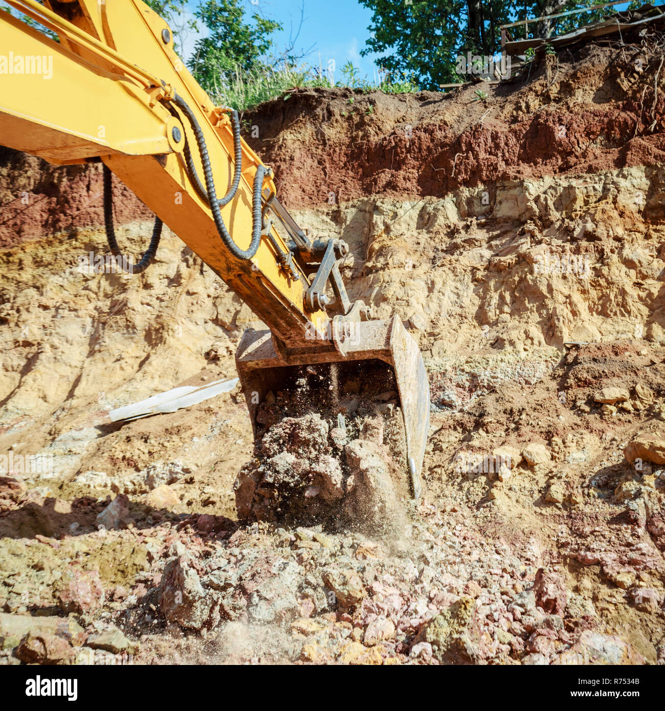 Excavator work on the construction site. Bucket closeup Stock Photo - Alamy