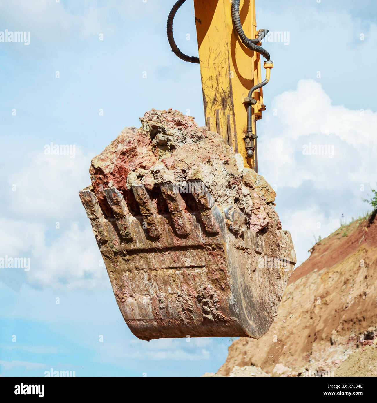 Excavator bucket with ground closeup Stock Photo - Alamy