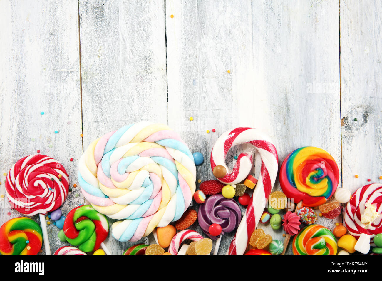 candies with jelly and sugar. colorful array of different childs sweets ...