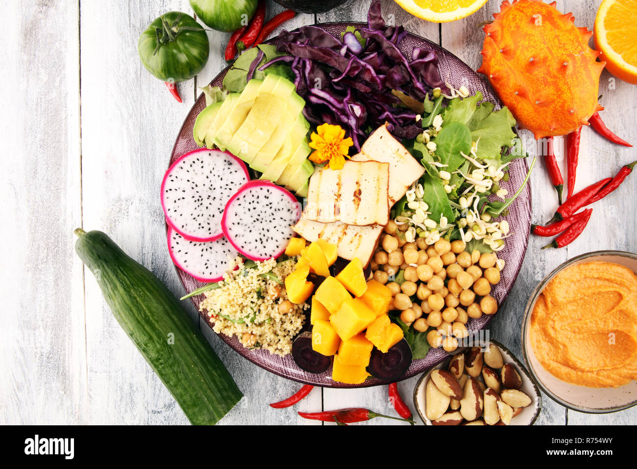 grilled tofu and dragon fruit buddha bowl with vegetable and humus ...