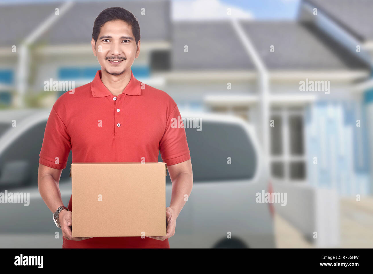 Young asian delivery man deliver the parcel Stock Photo - Alamy
