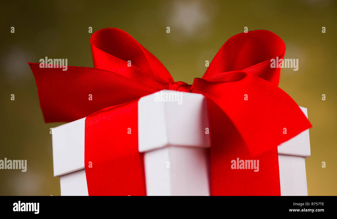 Christmas gift box, red ribbon Stock Photo - Alamy
