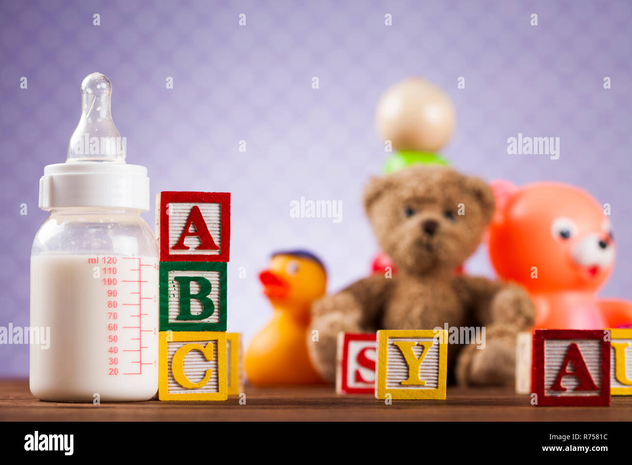 Children's of toy accessories on wooden background Stock Photo - Alamy