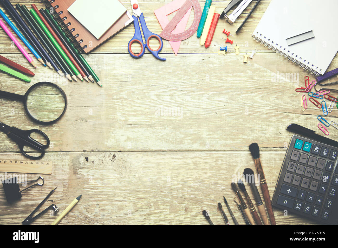 School and office supplies on wood background Stock Photo - Alamy