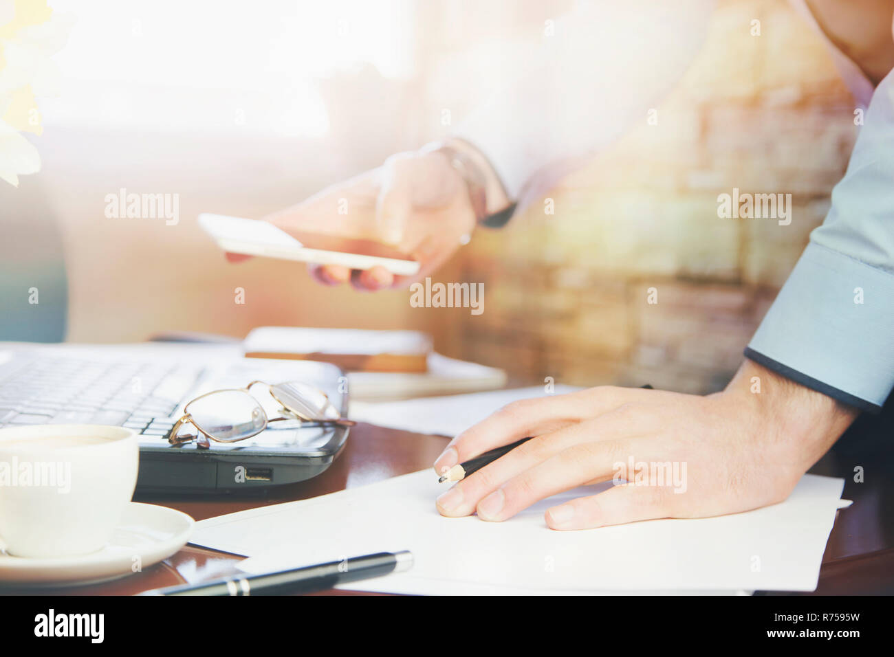 business man working hand pen and paper Stock Photo - Alamy