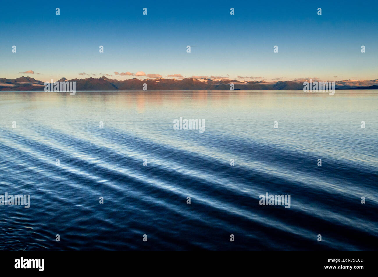 Ship bow wave ripples, Port side, in the quiet light of dawn with ...